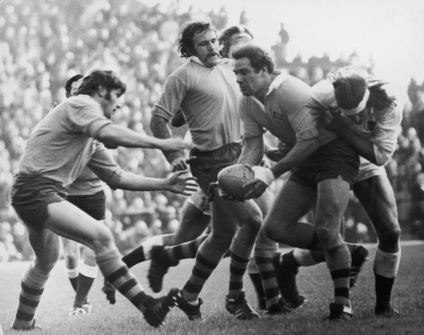 ANDY RIPLEY ENGLAND tackles Bruce Battishall Australia during - 1973 ...