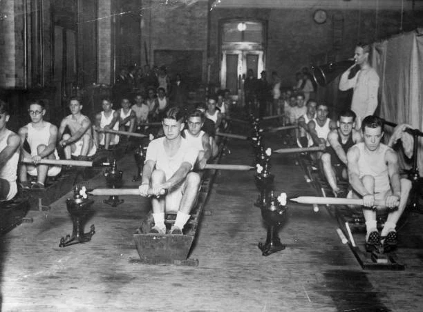 COLUMBIA UNIVERSITY ROWING crews practising on rowing machines 1924 Old ...