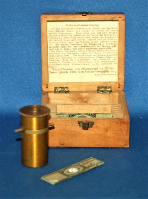 A ANTIQUE 19TH century brass pocket microscope, wooden box and two ...