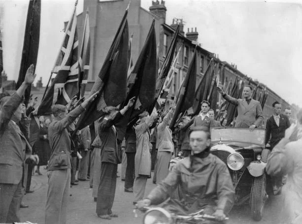 SIR OSWALD MOSLEY leader of British Union of Fascists driving past- Old ...
