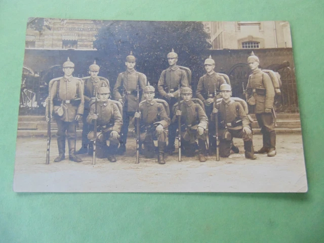 GROUP OF GERMAN Soldiers pose with rifles in front of Artillery Guns ...
