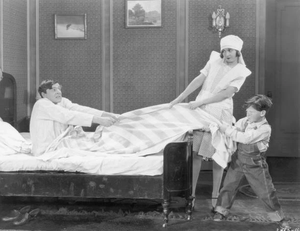 ACTORS LUCILLE HUTTON and Jackie Levine play tug-of-war with Ja- 1925 ...