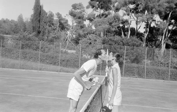 MEL FERRER AND his wife Audrey HEPBURN take a holiday in a whit 1956 ...