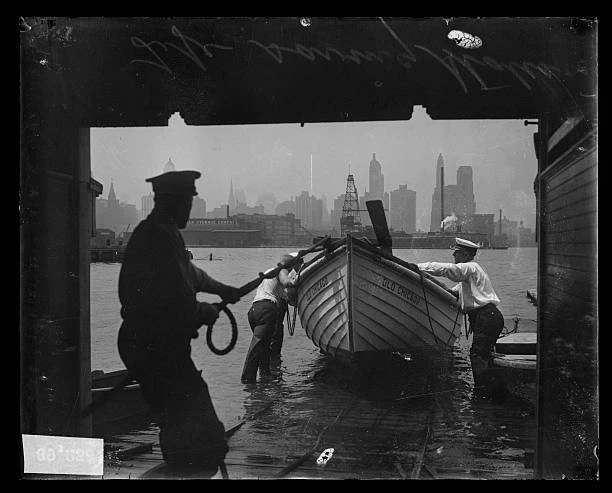 MEN PULLING THE Boat Old Chicago Up A Ramp Into The Old Chicago C - Old ...