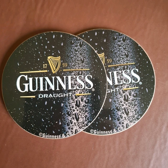 11 ITEMS OF Guinness Memorabilia Items inc beer mats,candle, socks ...