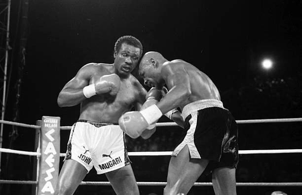 MARVIN HAGLER LANDS A Punch Against John Mugabi 2 Old Boxing Photo $9. ...