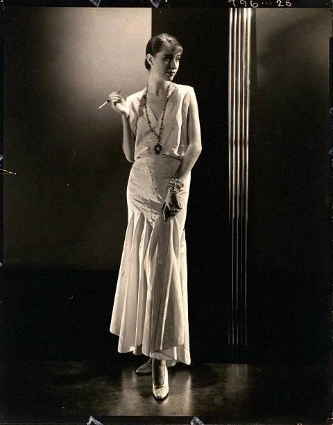 MARION MOREHOUSE WEARING white moire V neck dress fitted in the 1930s ...