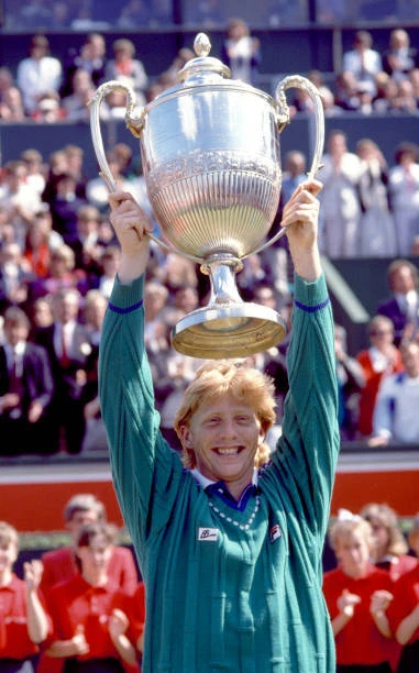 BORIS BECKER OF West Germany lifts the trophy after defeating Ste - Old ...