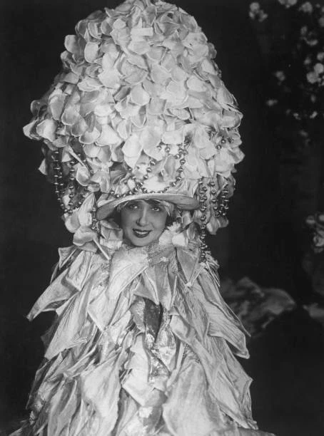 FRENCH SINGER & dancer Mistinguett, wearing an elaborate hat, poss Old ...